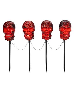 Light-Up LED Burning Skull Pathway Markers - Spirithalloween.com
